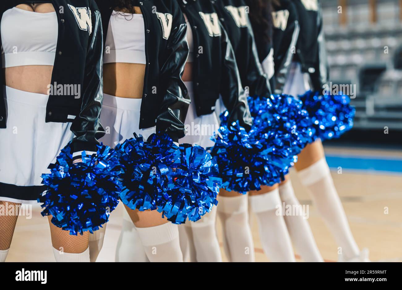 Closeup cheerleader women in black and white uniform with ankle socks ...
