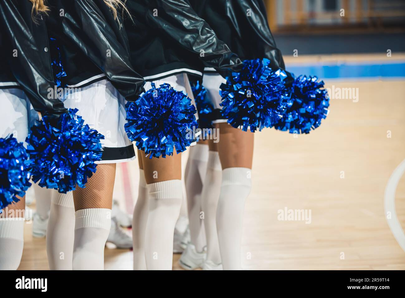 Closeup legs of cheerleader women in white ankle socks with blue ...