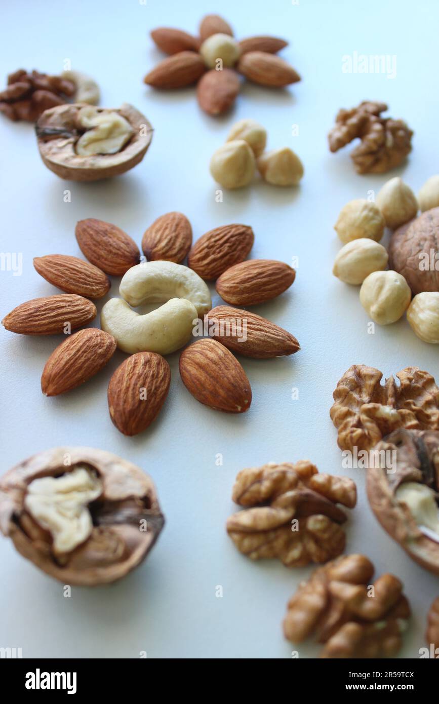 Vertical Photo Of Variety Ready To Eat Nuts Kernels In A Flowers Shape ...