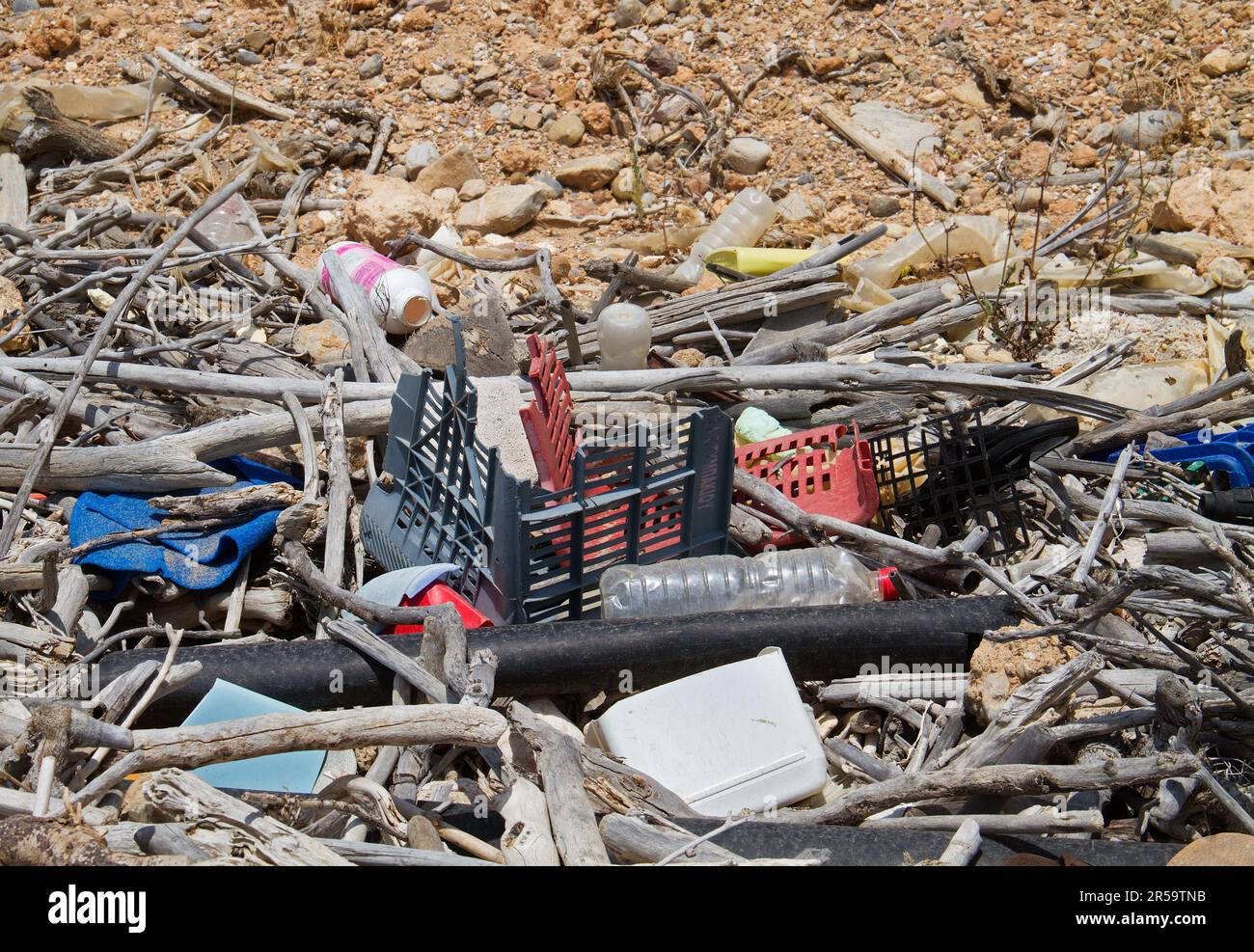 Plastic soup; lots of plastic trash washed ashore on the beach of Crete ...