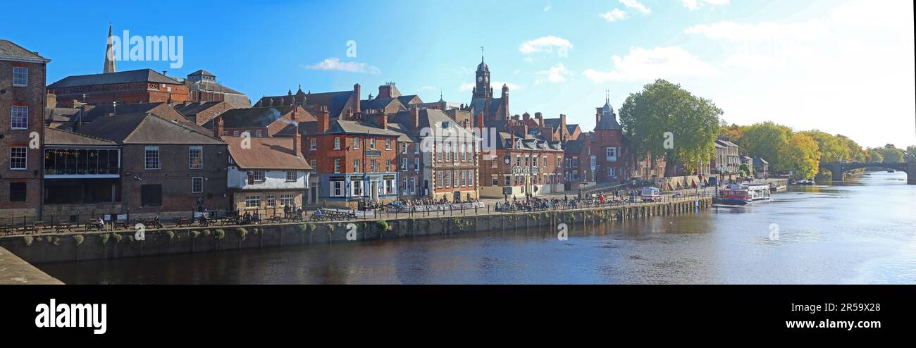 People enjoying the waterfront along the River Ouse in York during ...