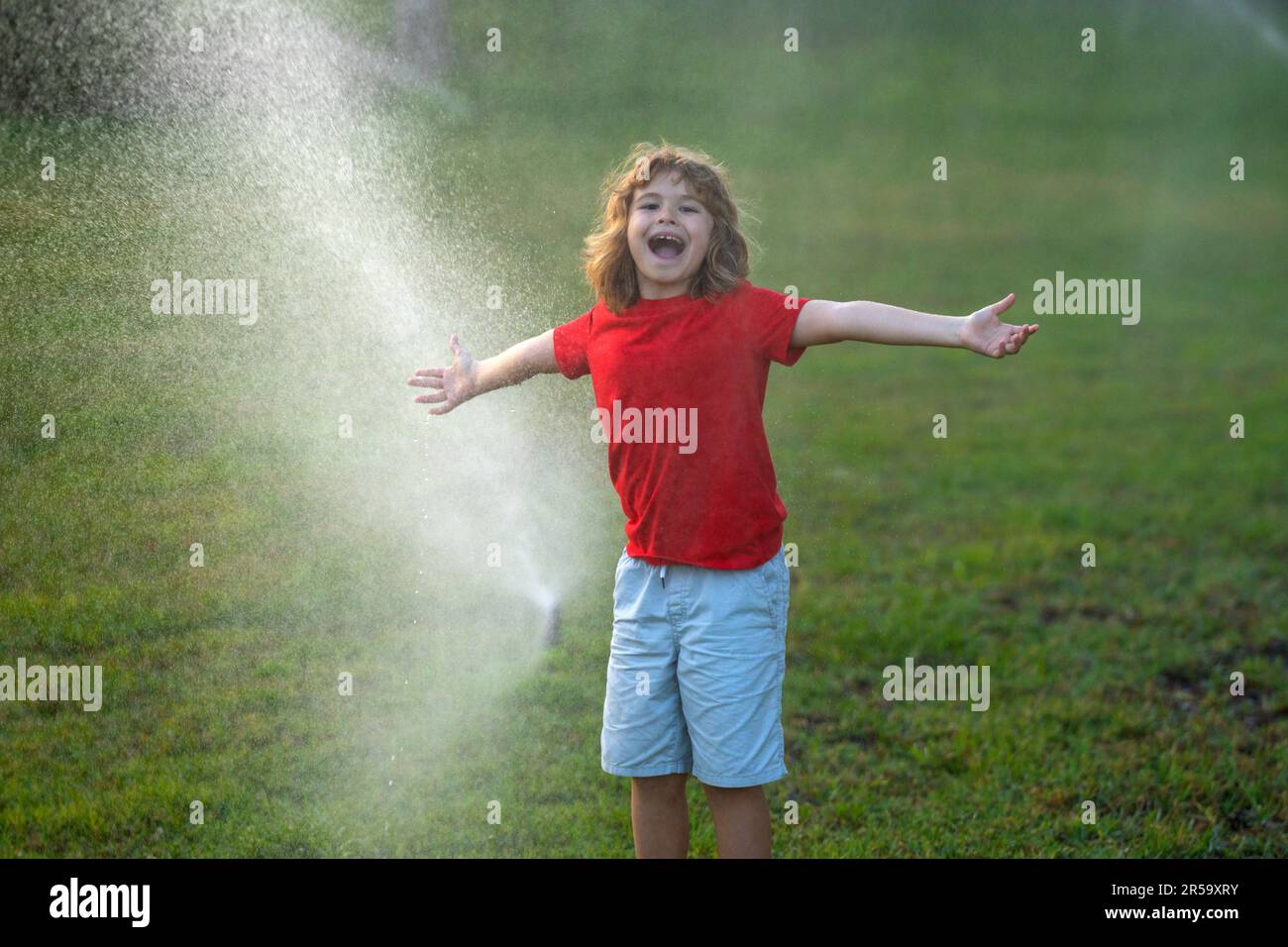 Cute little kid play in garden at summer day. Child enjoy summer in ...