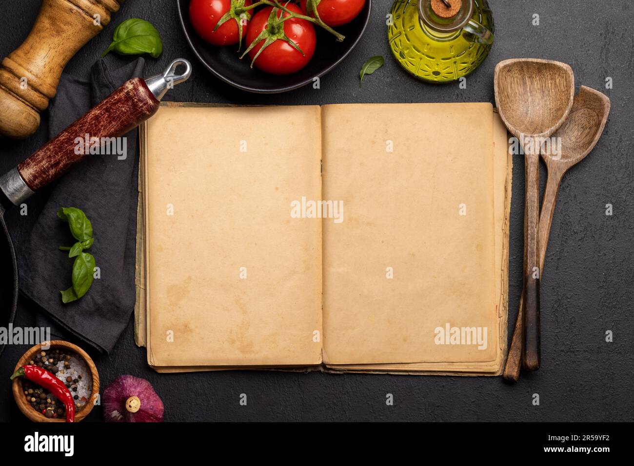Top-down view of a kitchen table with ingredients, utensils, and an ...