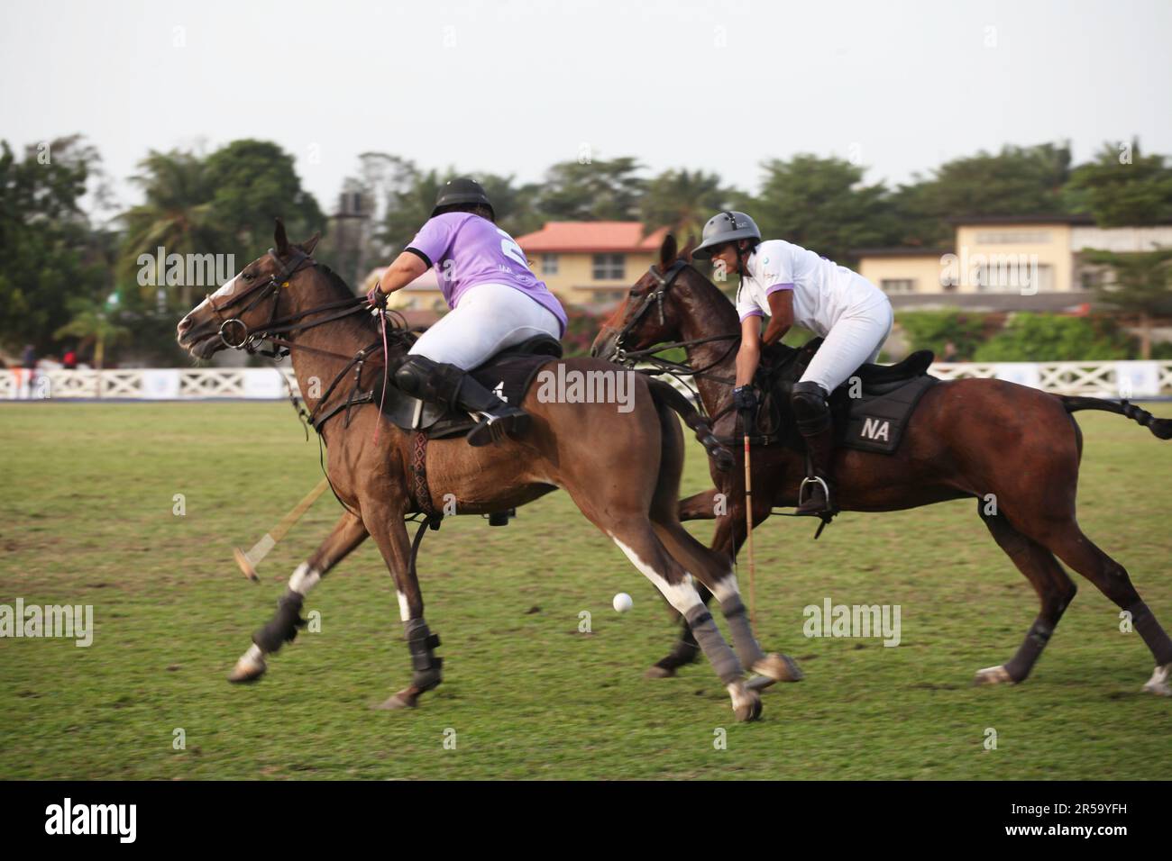Polo players compete for the ball during the Ladies Polo invitation ...