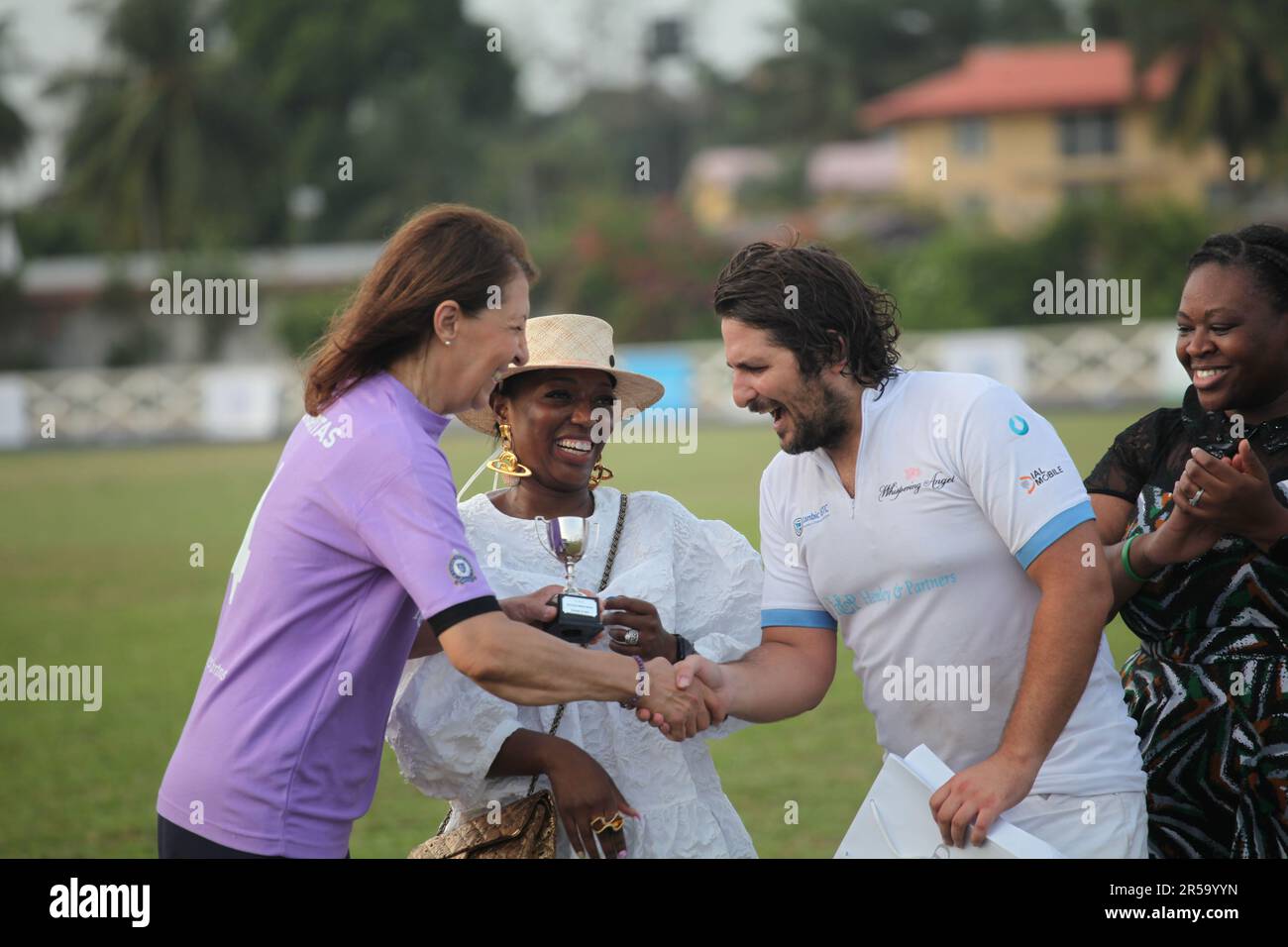A polo player receives an award during the Ladies Polo invitation ...