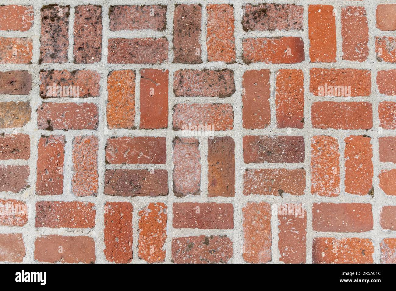 Texture and detail of a brick footpath. Wallpaper or stone backdrop ...