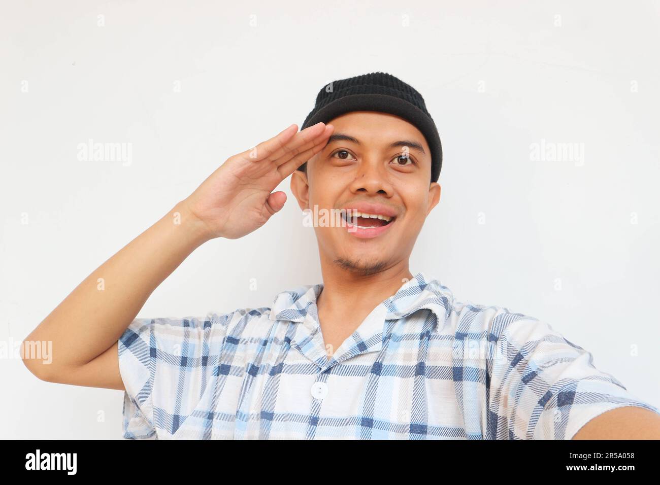 Saluting smiley hi-res stock photography and images - Alamy
