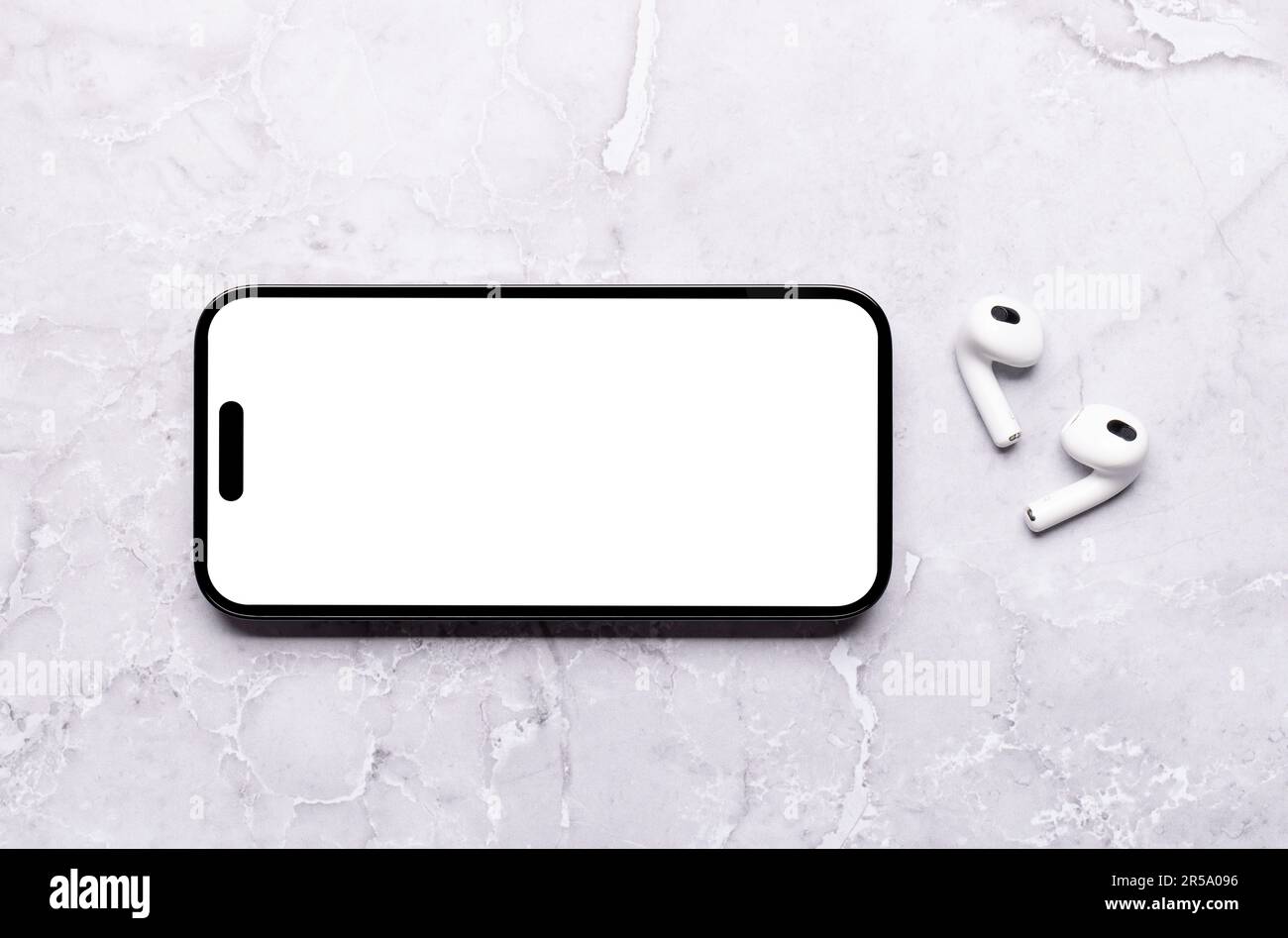 Blank white screen smartphone on a desk, perfect for your design mockup ...