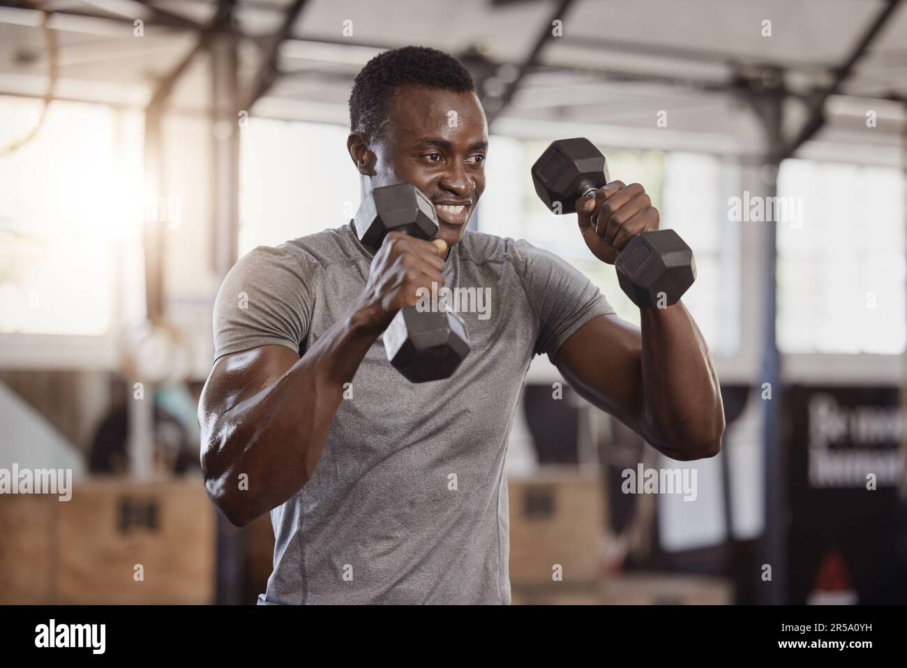 Dumbbells, exercise and a happy black man at gym for fitness, training ...