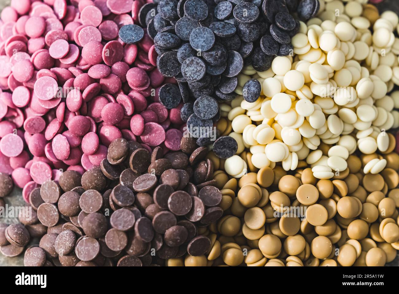 Ruby white and dark chocolate callets closeup - Tempered chocolate ...