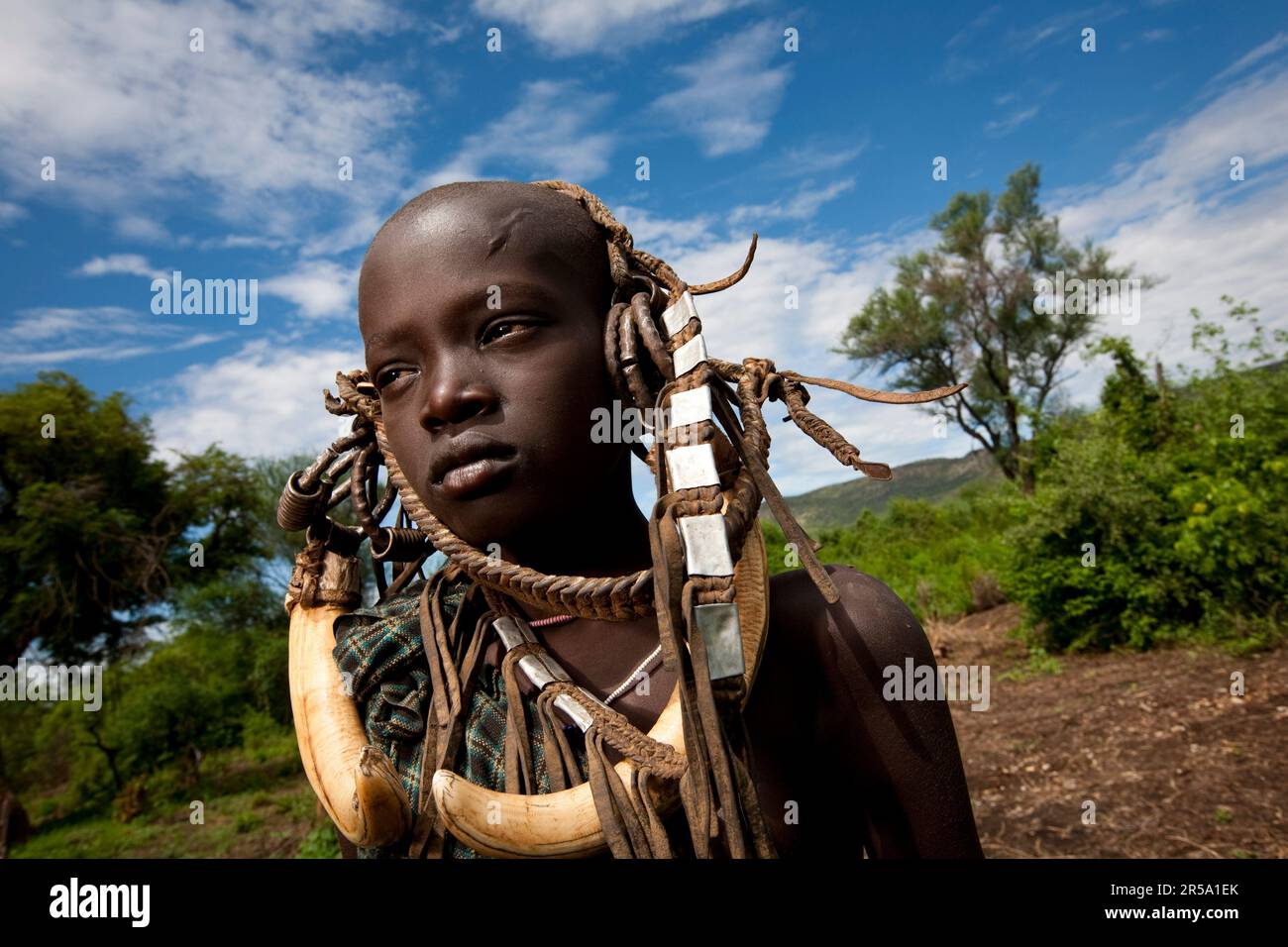 Portrait of a Mursi boy with an ornate head dress, Lower Omo Valley ...