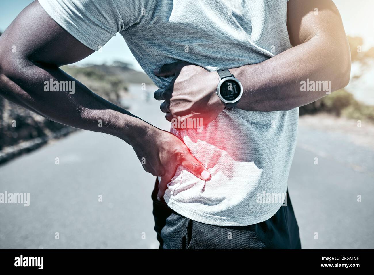 Exercise, back pain and injury with a sports man holding his sore body ...