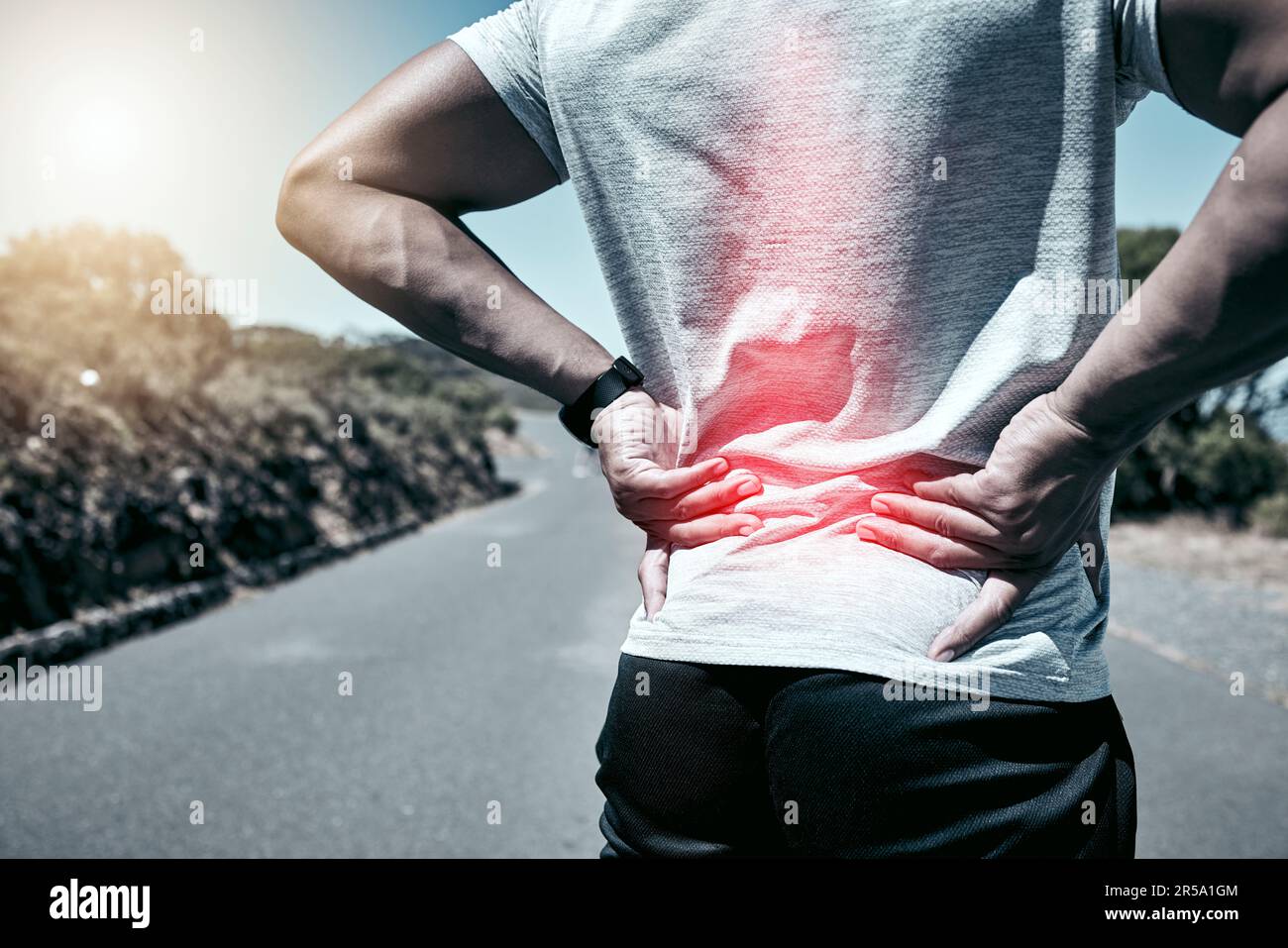 Fitness, back pain and injury with a sports man holding his sore body ...