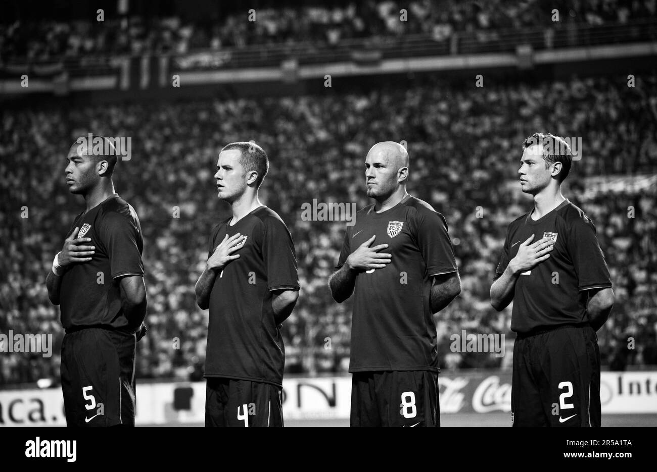 The US soccer team listens to the National Anthem before the game ...
