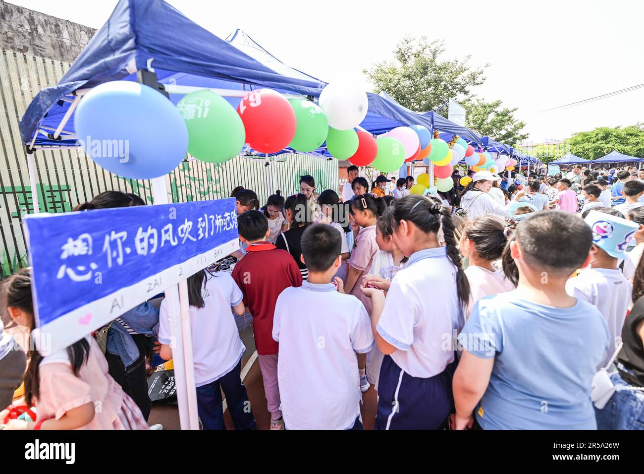 Students sell and buy goods at a campus flea market in Jinan City, east ...