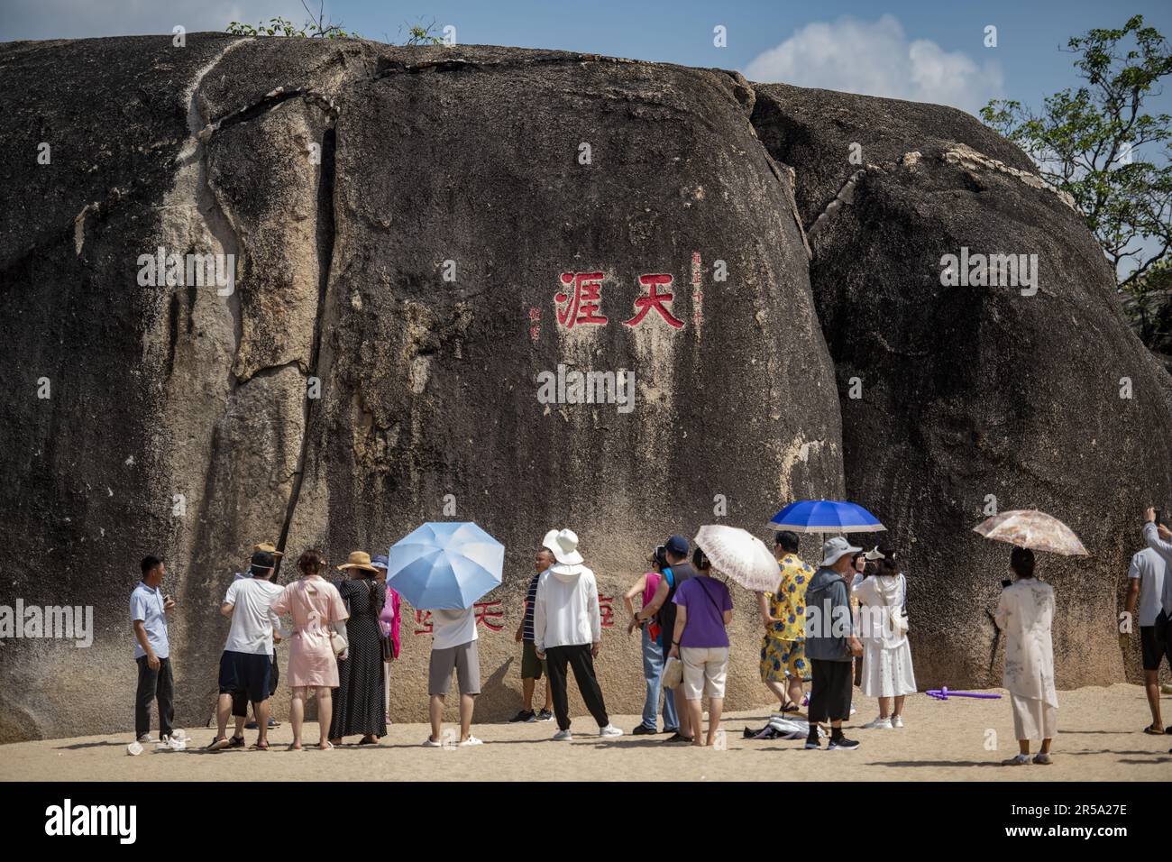 Tourists visit the Tianya Haijiao Scenic Area in Sanya City, southernmost China's Hainan ...
