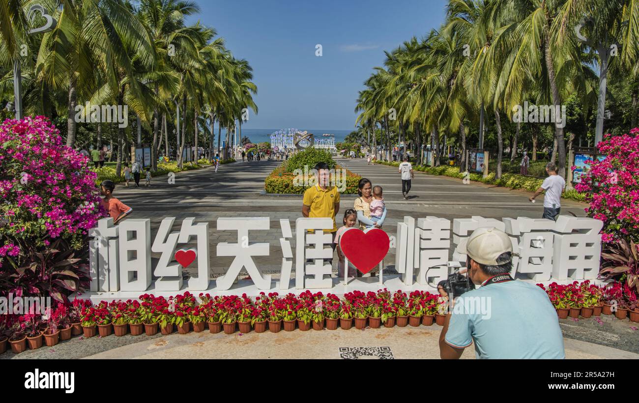 Tourists visit the Tianya Haijiao Scenic Area in Sanya City, southernmost China's Hainan ...