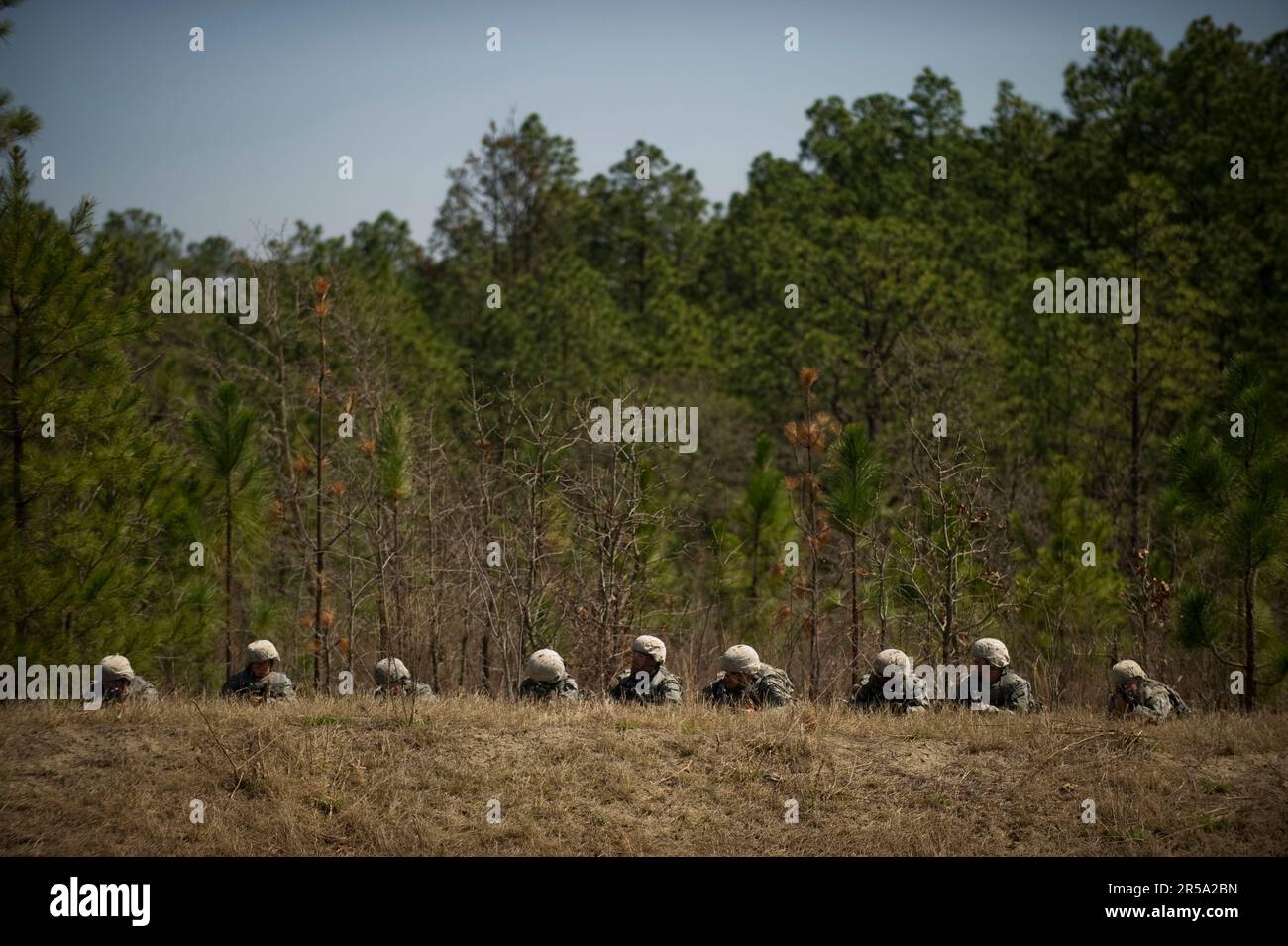 Soldiers in basic training move tactically as a squad during close ...