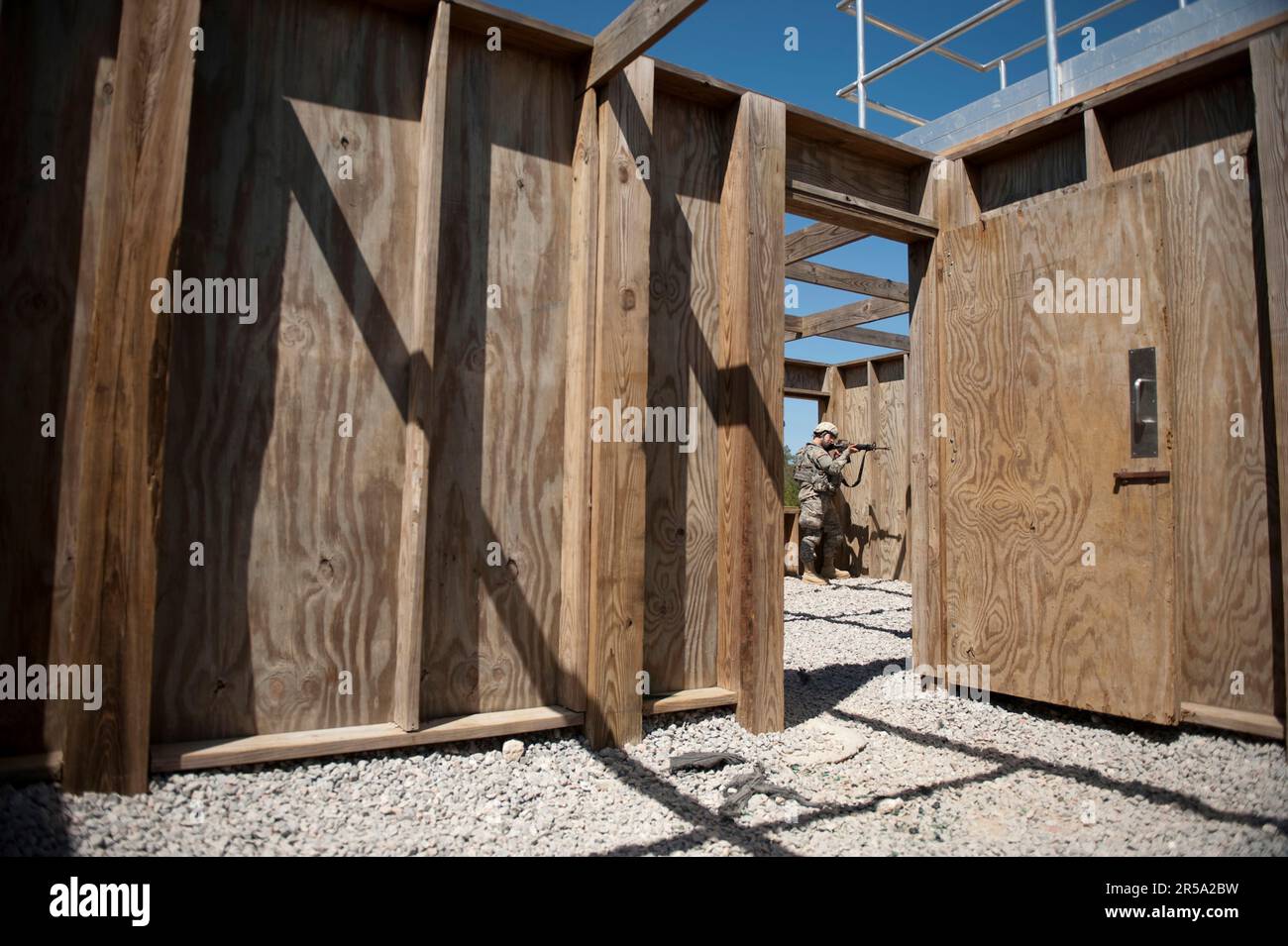 A soldier basic training clears the first room during close quarters combat training Stock Photo ...