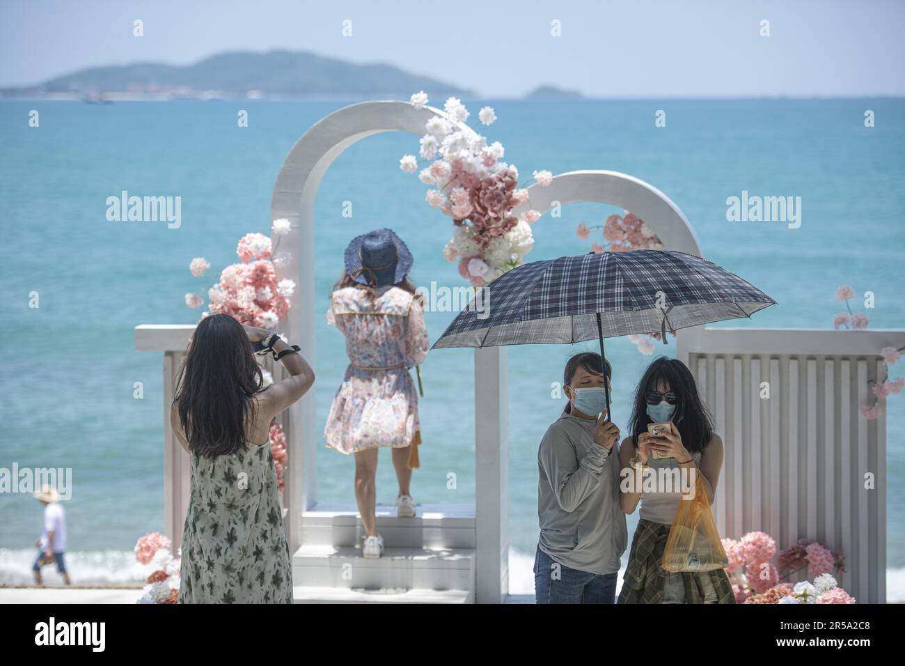 Tourists visit the Tianya Haijiao Scenic Area in Sanya City, southernmost China's Hainan ...
