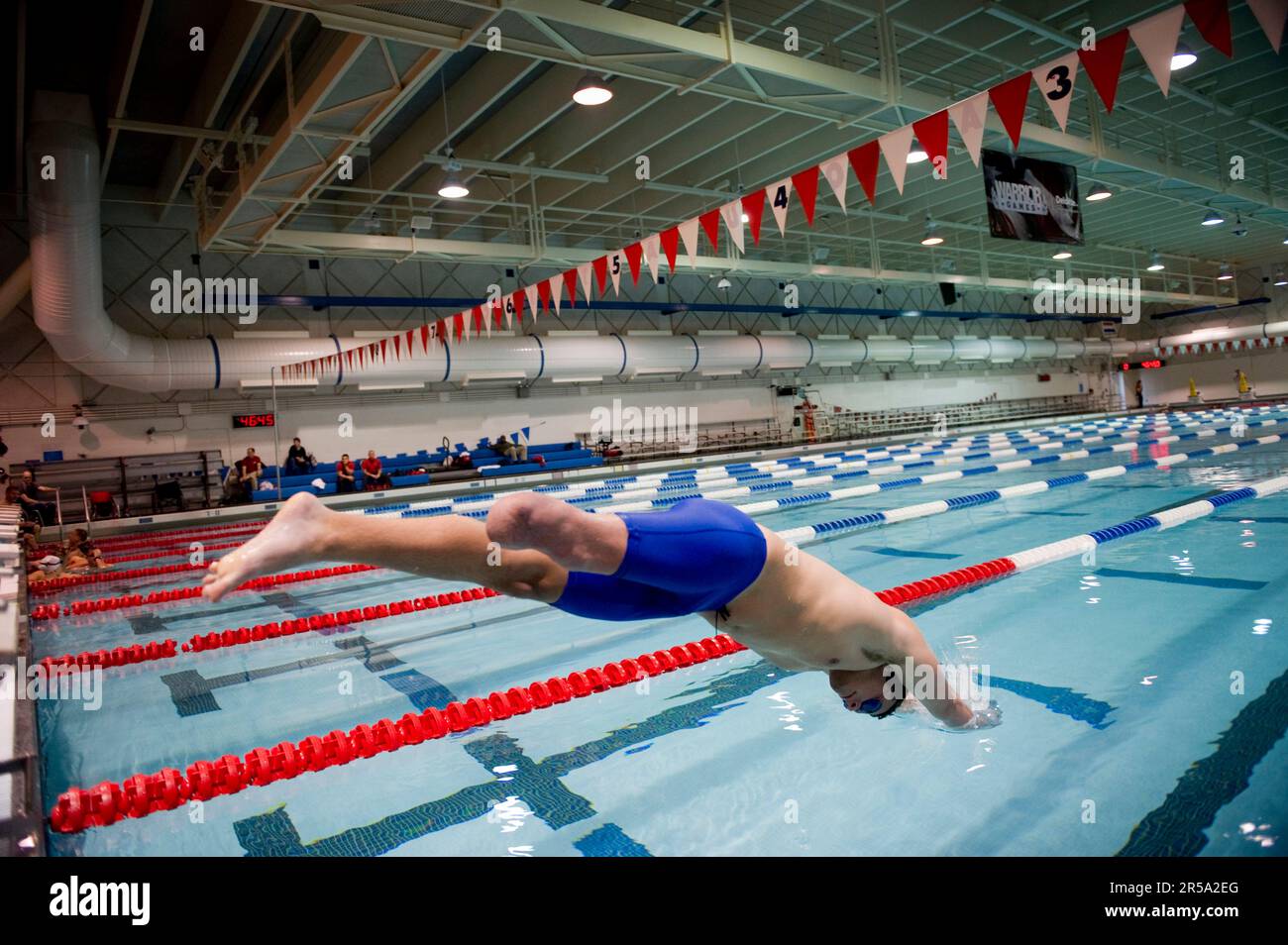 An athlete, who only has one leg, launches from the starter block ...
