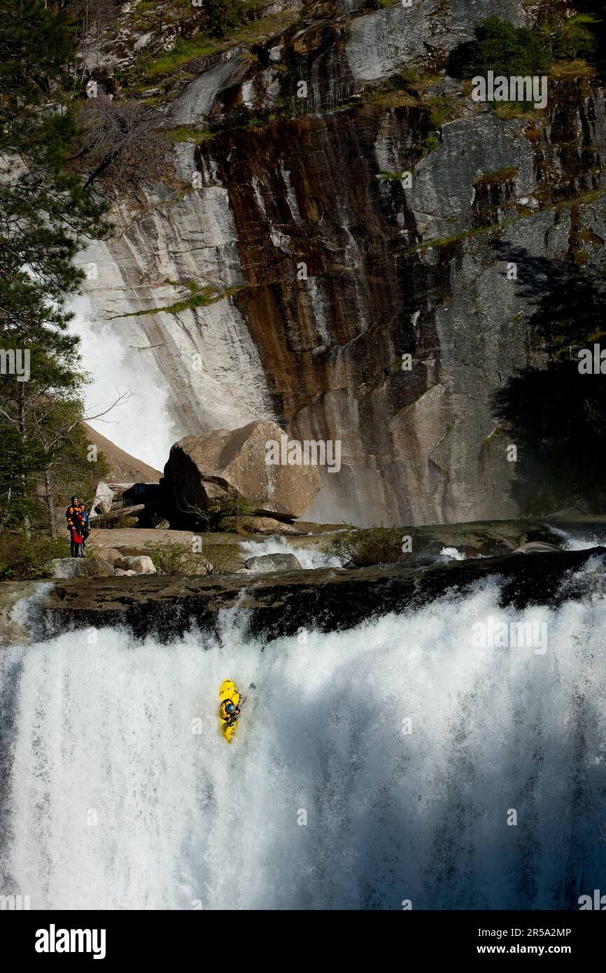 Kayaker dropping a big waterfall in a steep granite gorge Stock Photo ...