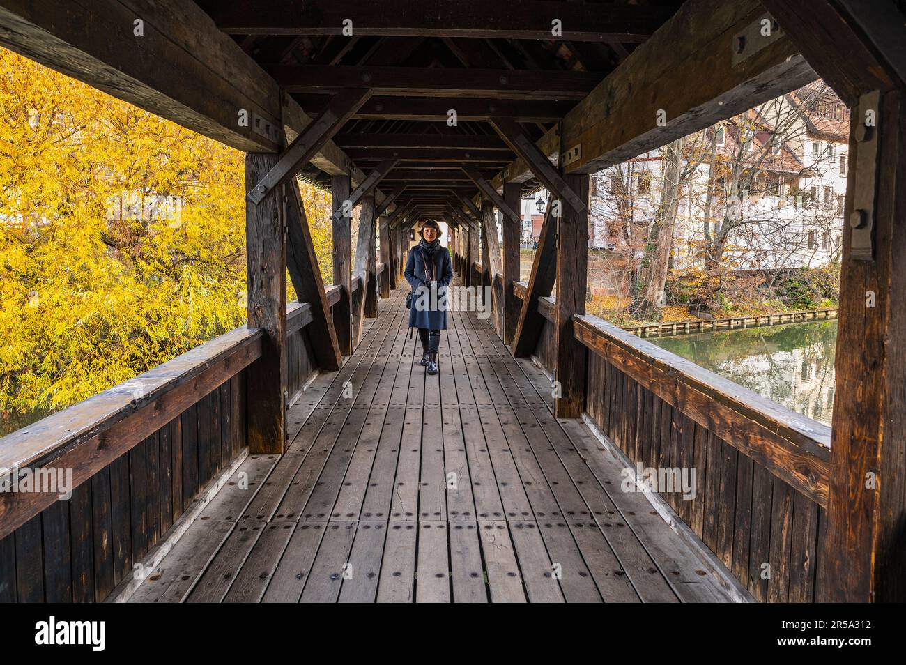 woman walking over wooden bridge in Nuremberg / Germany Stock Photo - Alamy