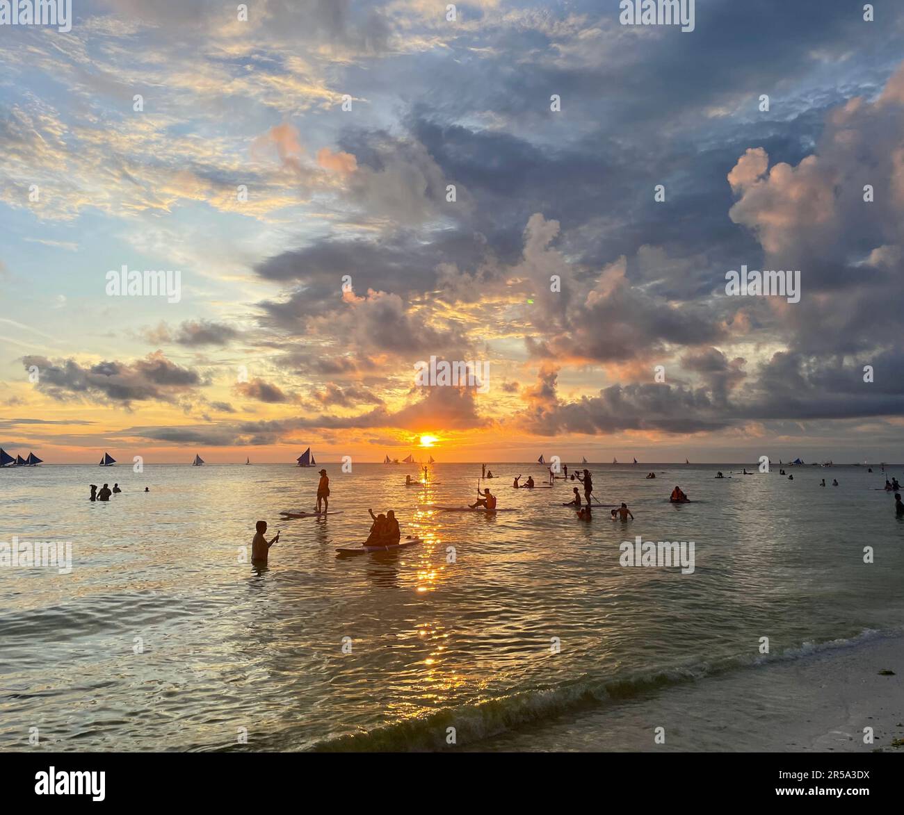 Family Beach Summer vacation Overlooking Sunset Stock Photo - Alamy