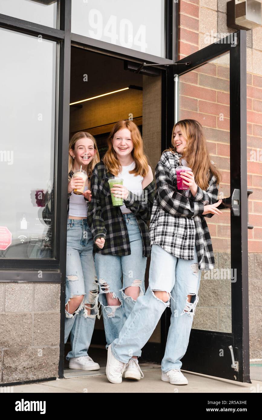Three teen girls laughing conversation hi-res stock photography and ...