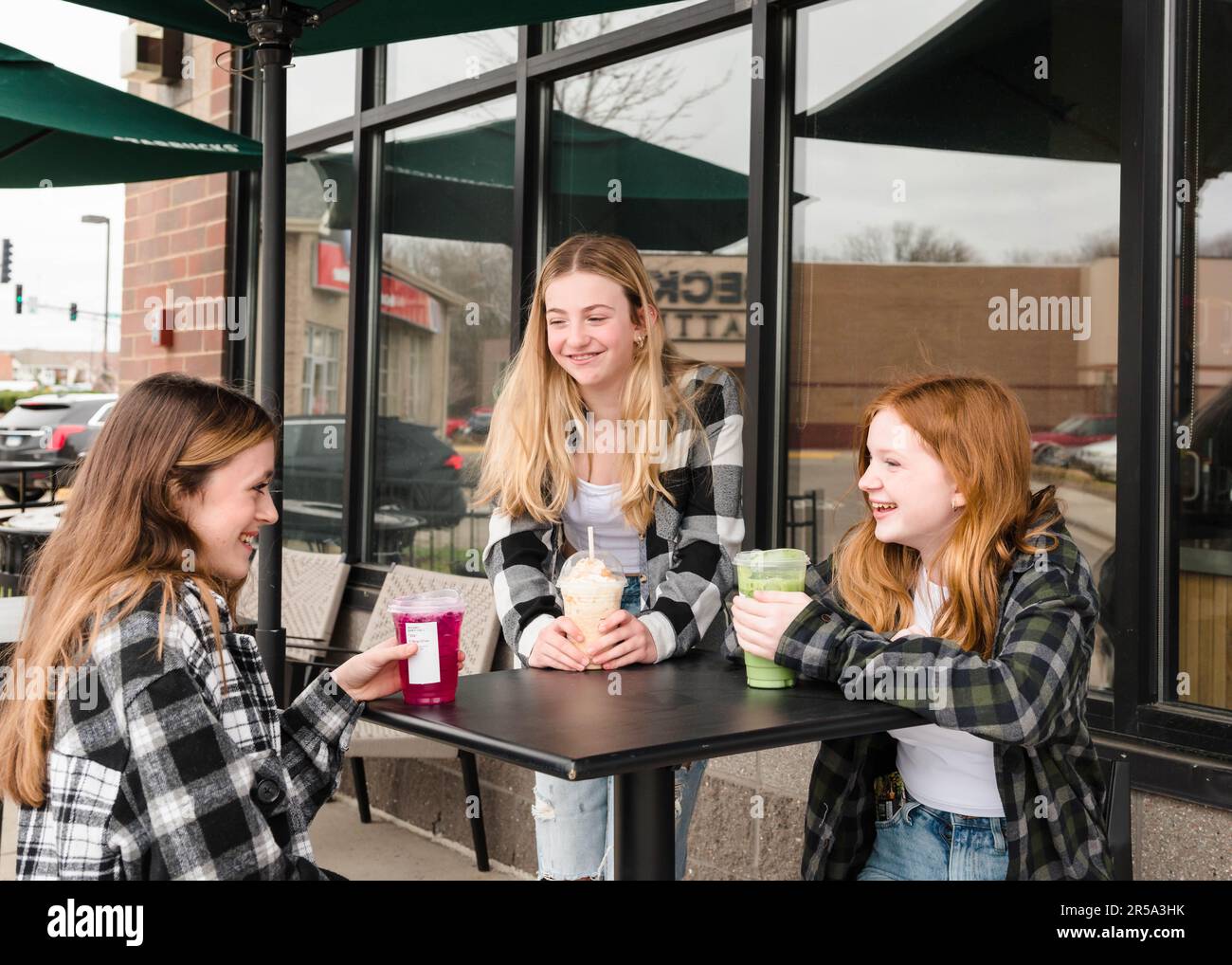 Three teen girls laughing conversation hi-res stock photography and ...