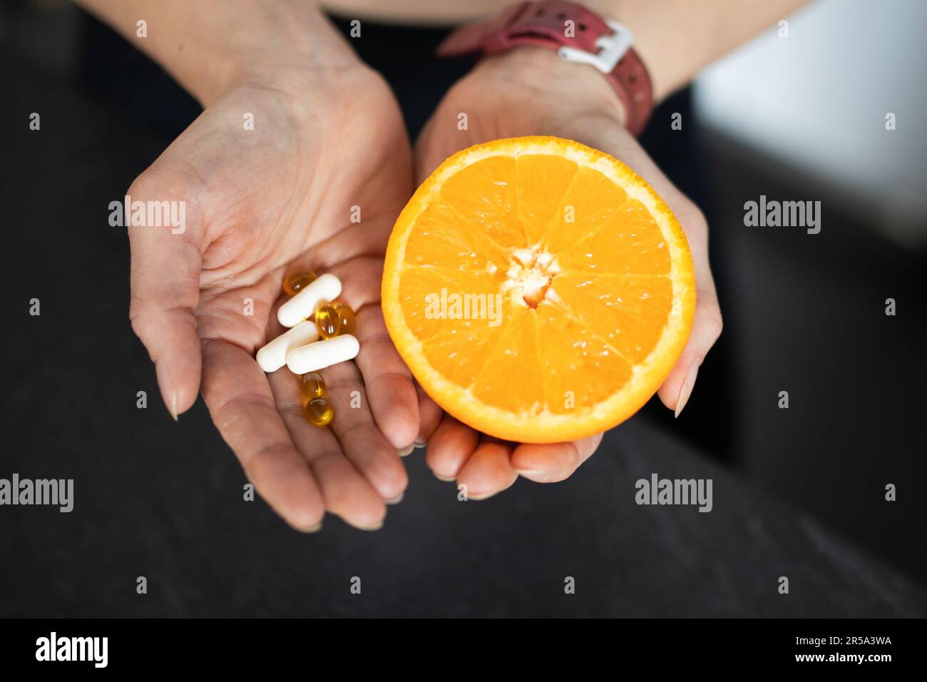 Female hands holding orange hi-res stock photography and images - Alamy
