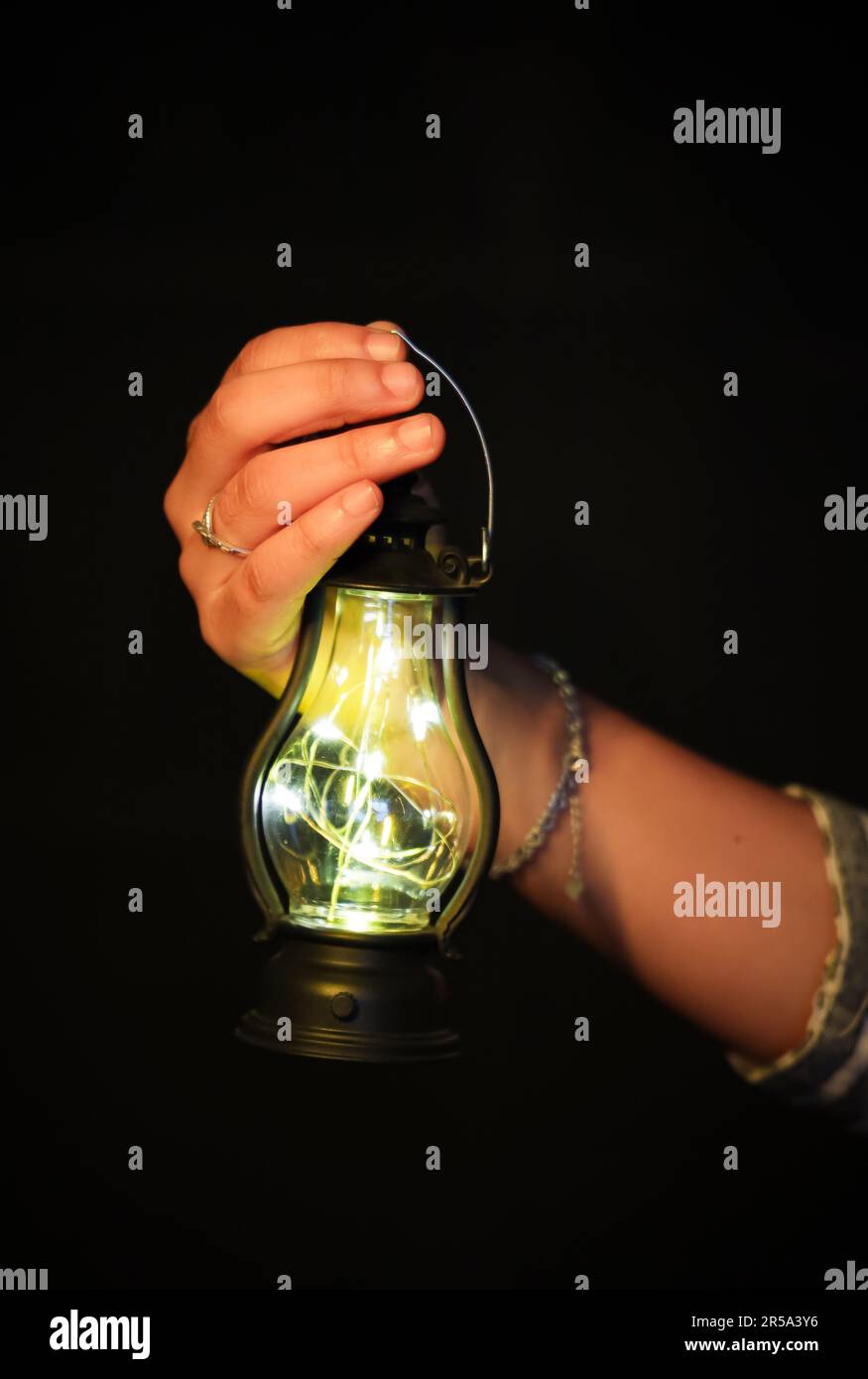 Dark night lamp with girl Stock Photo - Alamy