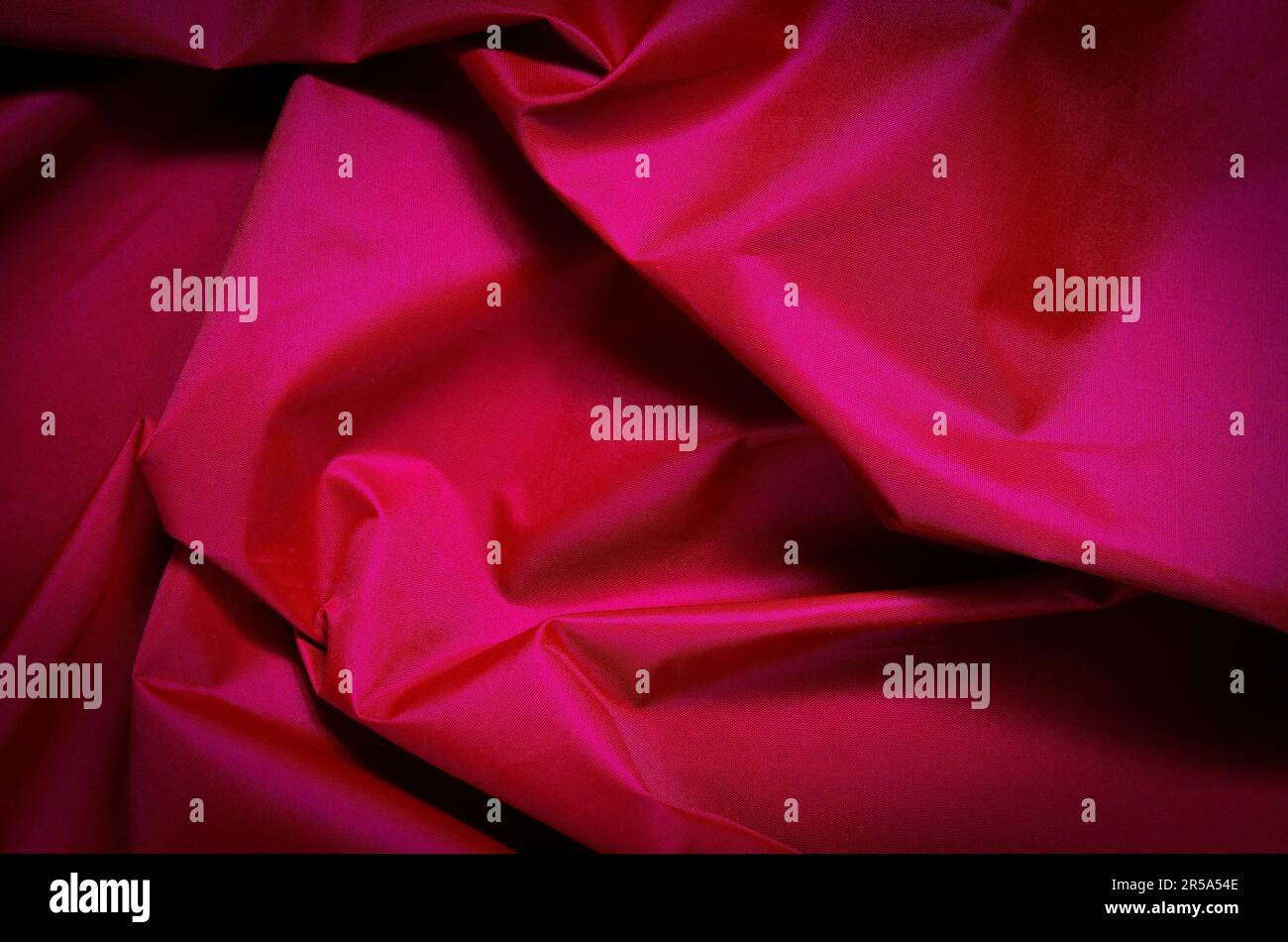 Pink wrinkled fabric texture. Close-up of textile structure, may be ...