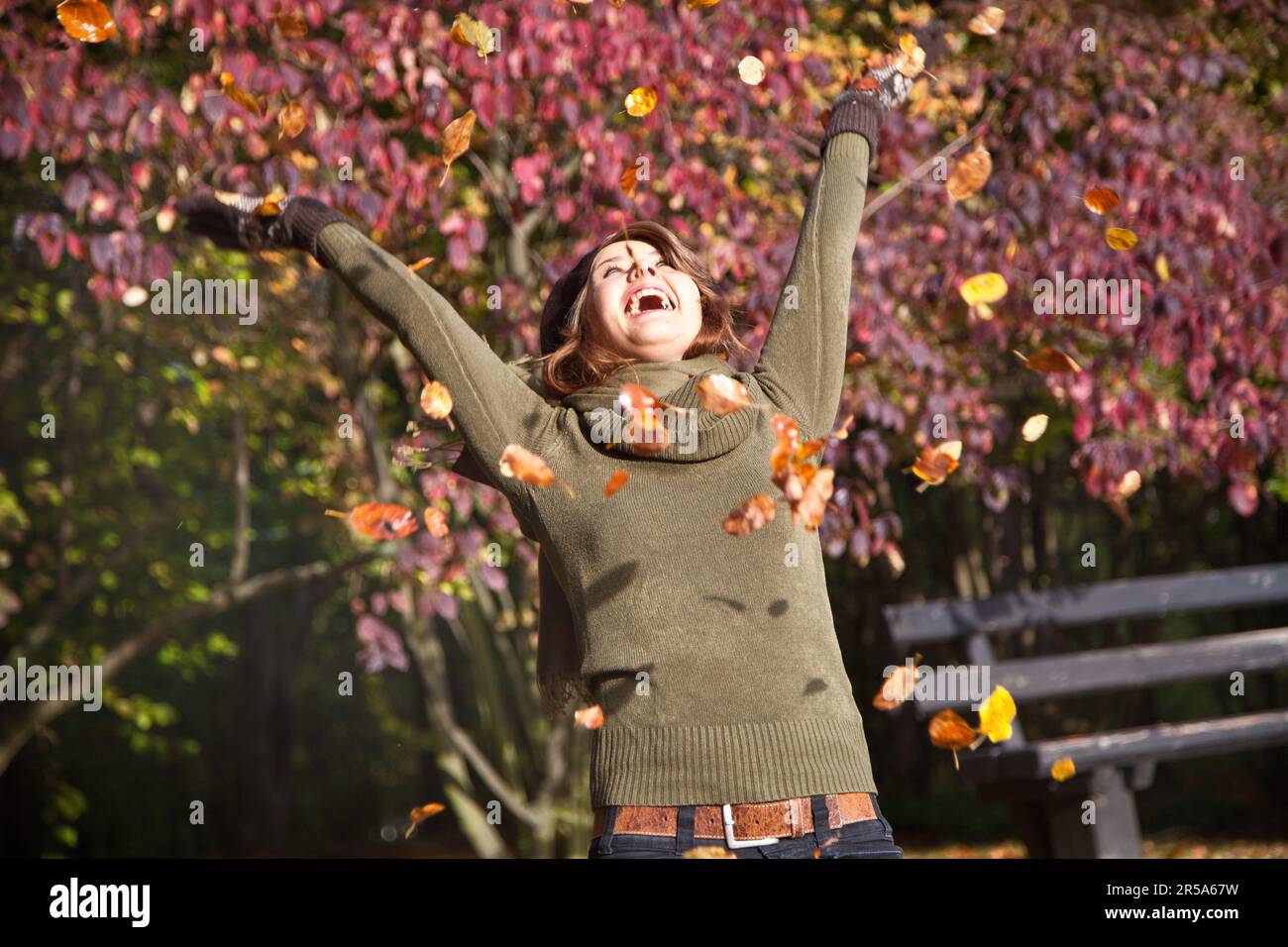 Woman throwing leaves up hi-res stock photography and images - Alamy
