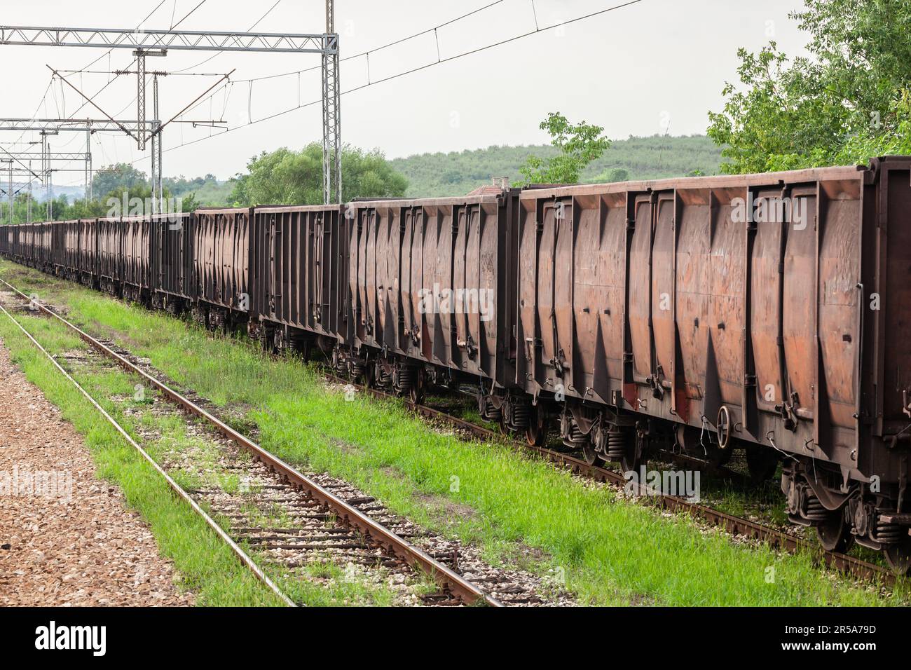 Picture of several wagons, main open or gondola, standing in the half ...