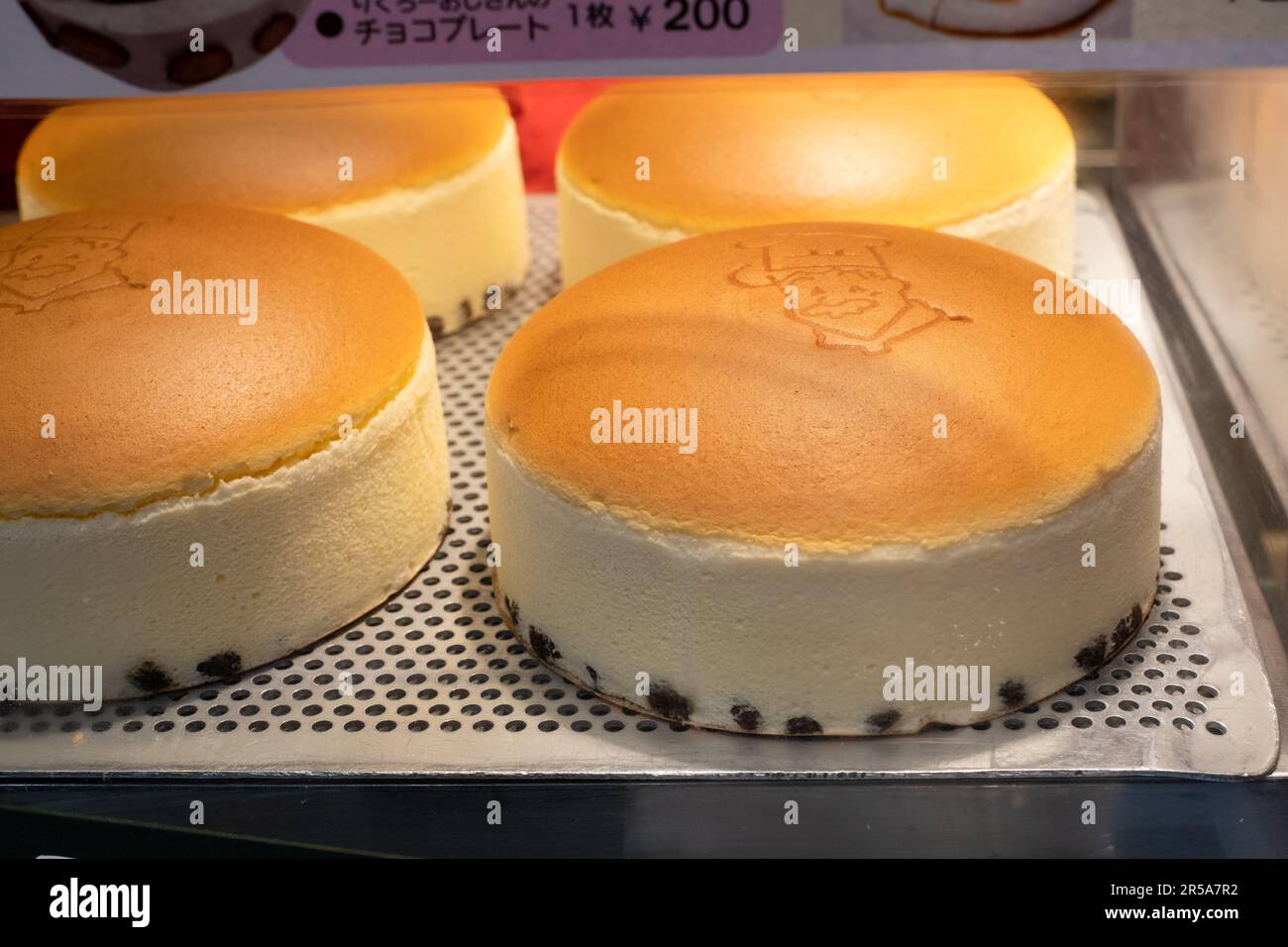 Rikuro's freshly baked cheese cake on display in the shop, Osaka Stock ...