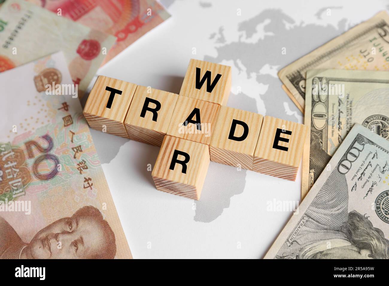 Words Trade war made of wooden cubes, dollar and yuan banknotes on ...