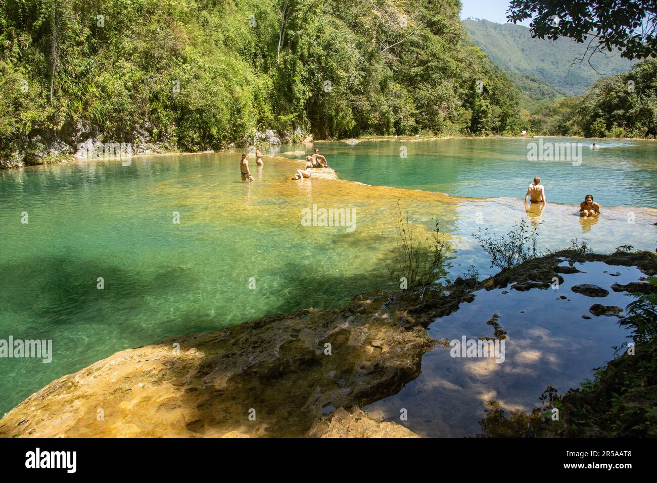 Tourists enjoying the beautiful pools of Semuc Champey, Rio Cabohon ...