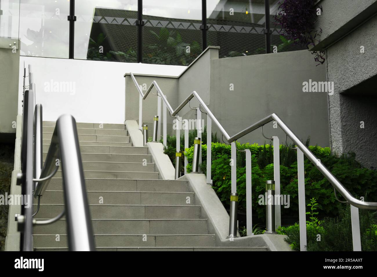 Outdoor staircase with metal handrails on city street Stock Photo - Alamy