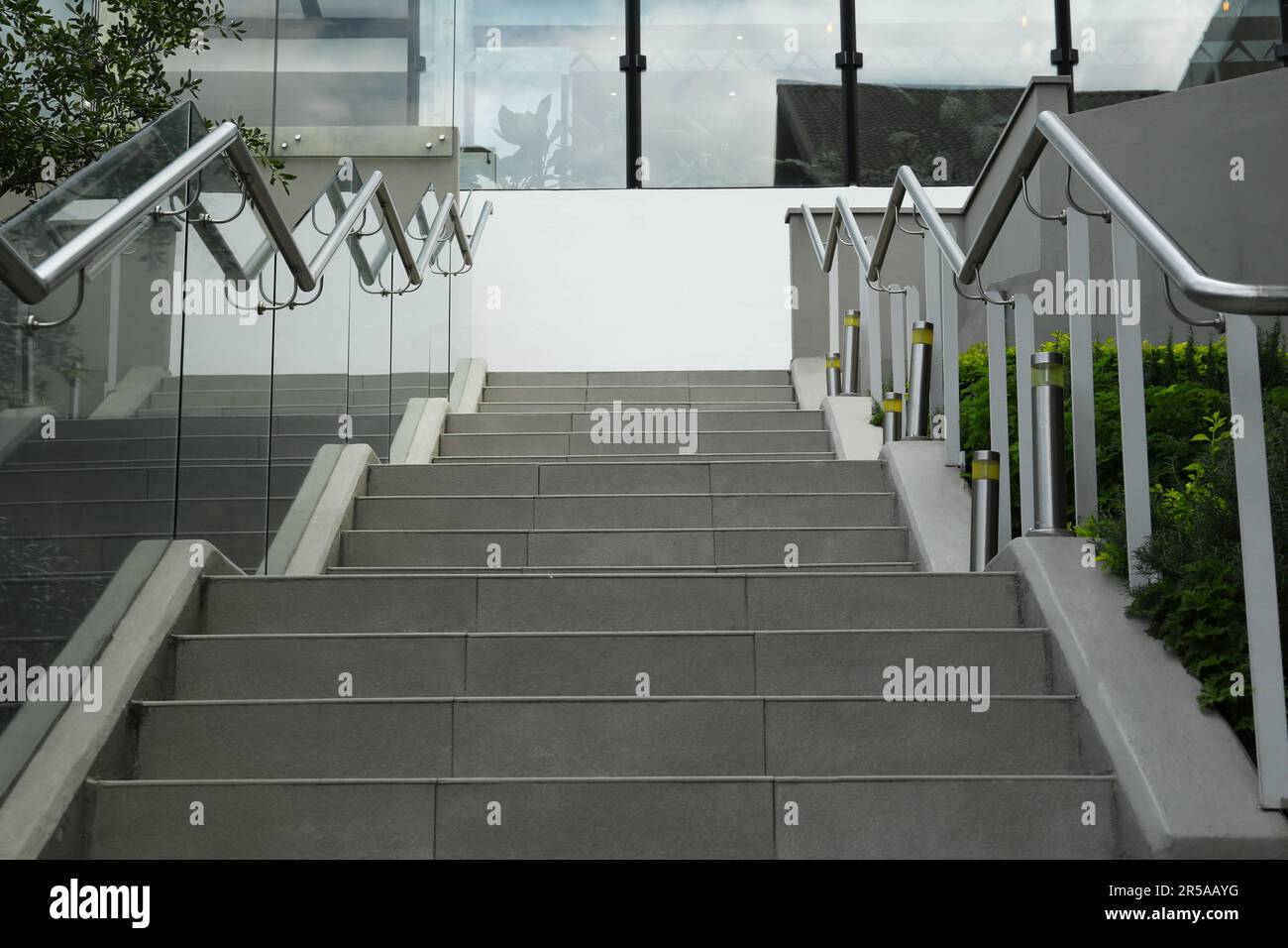 Outdoor staircase with metal handrails on city street Stock Photo - Alamy