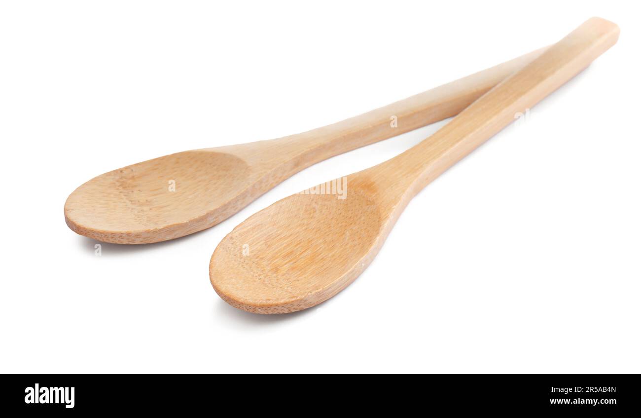 Two new wooden spoons on white background Stock Photo - Alamy