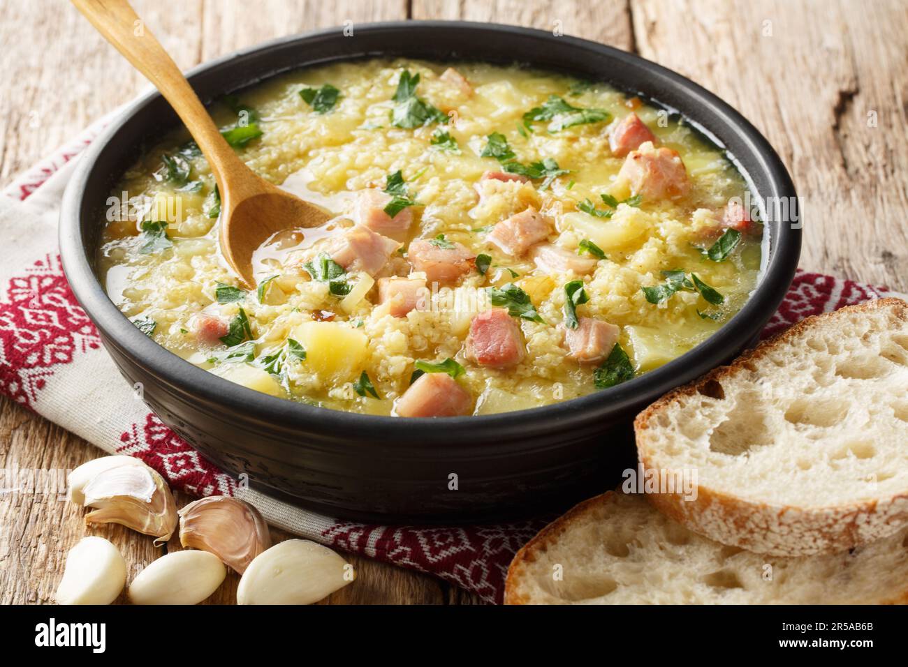 Ukrainian Cossack thick soup kulesh from millet with cracklings close ...
