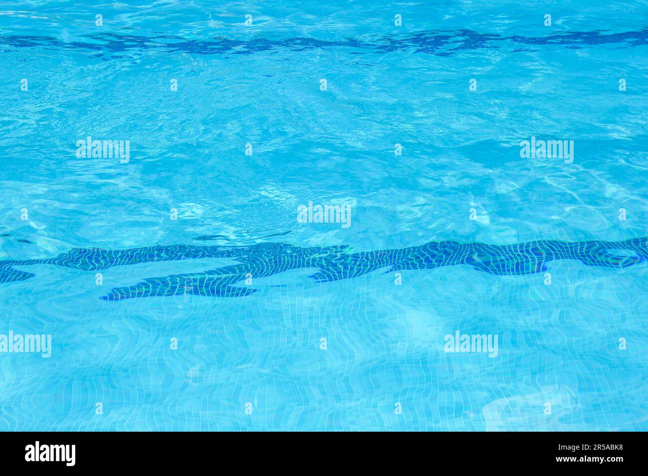 Outdoor swimming pool with clear rippled water Stock Photo - Alamy