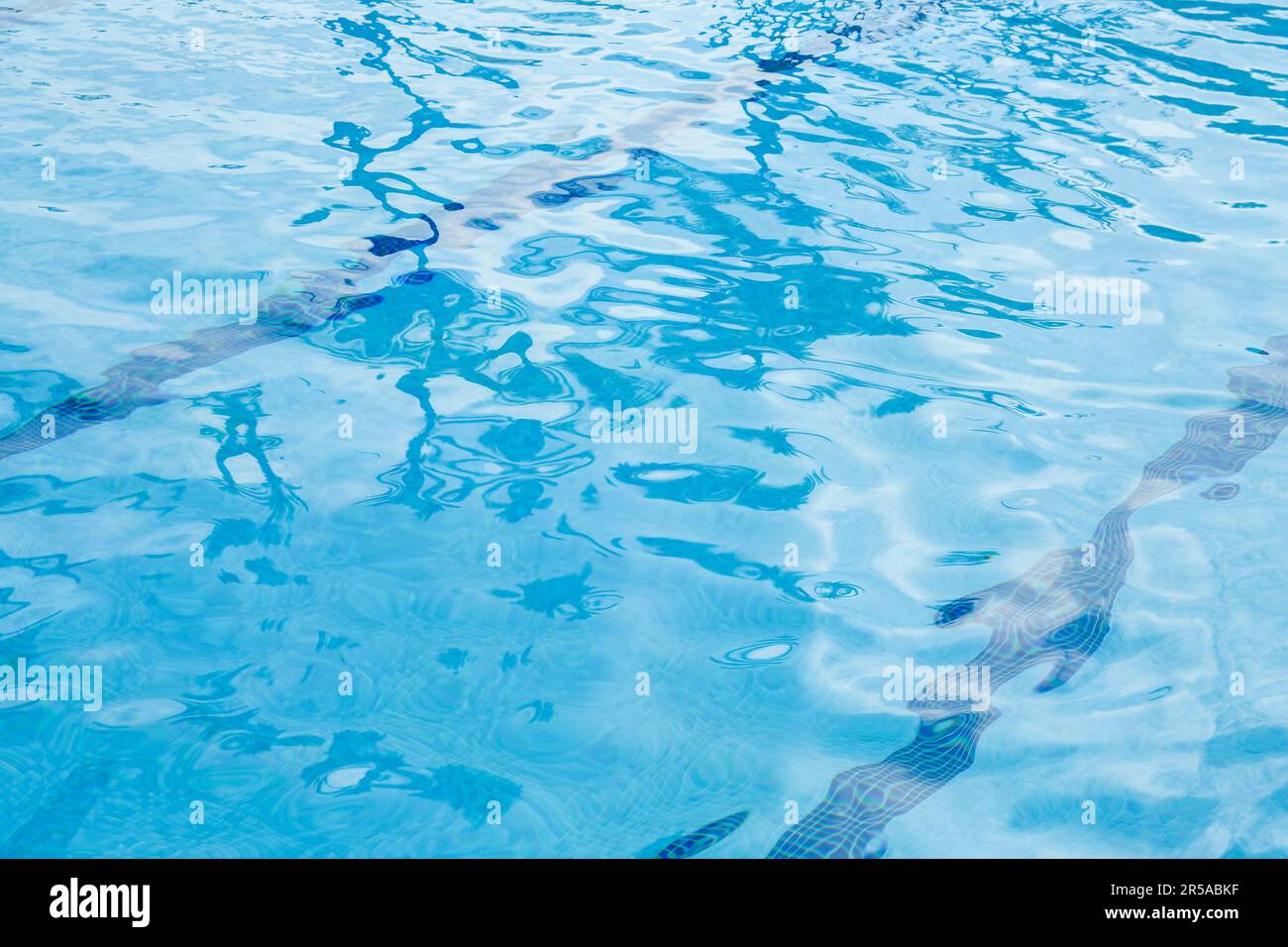 Outdoor swimming pool with clear rippled water Stock Photo - Alamy