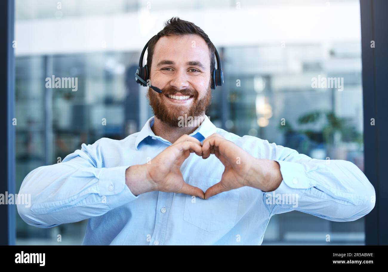 Callcenter agent, man with smile and heart hands in portrait, love ...