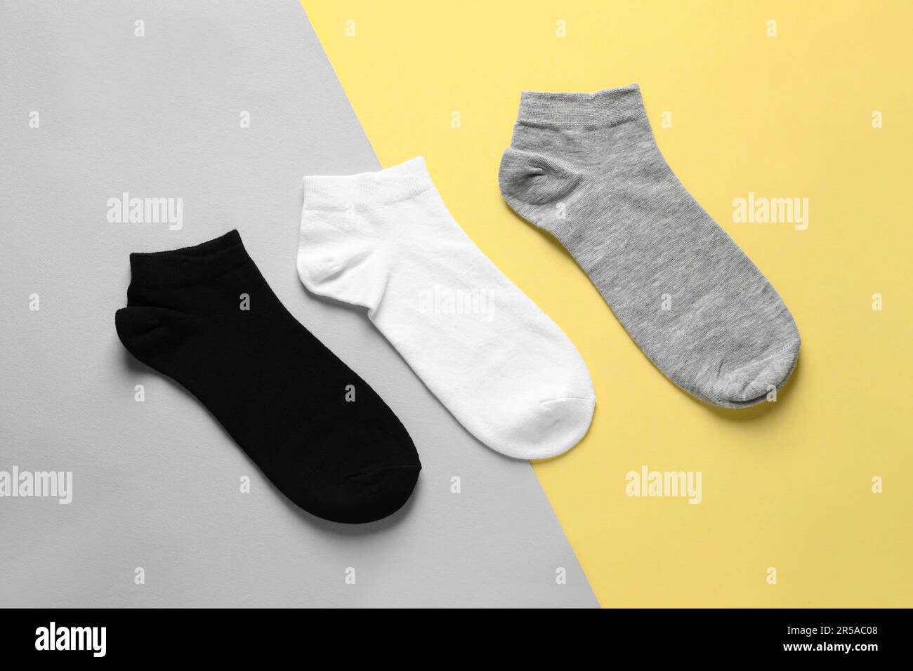 Different socks on colorful background, flat lay Stock Photo - Alamy