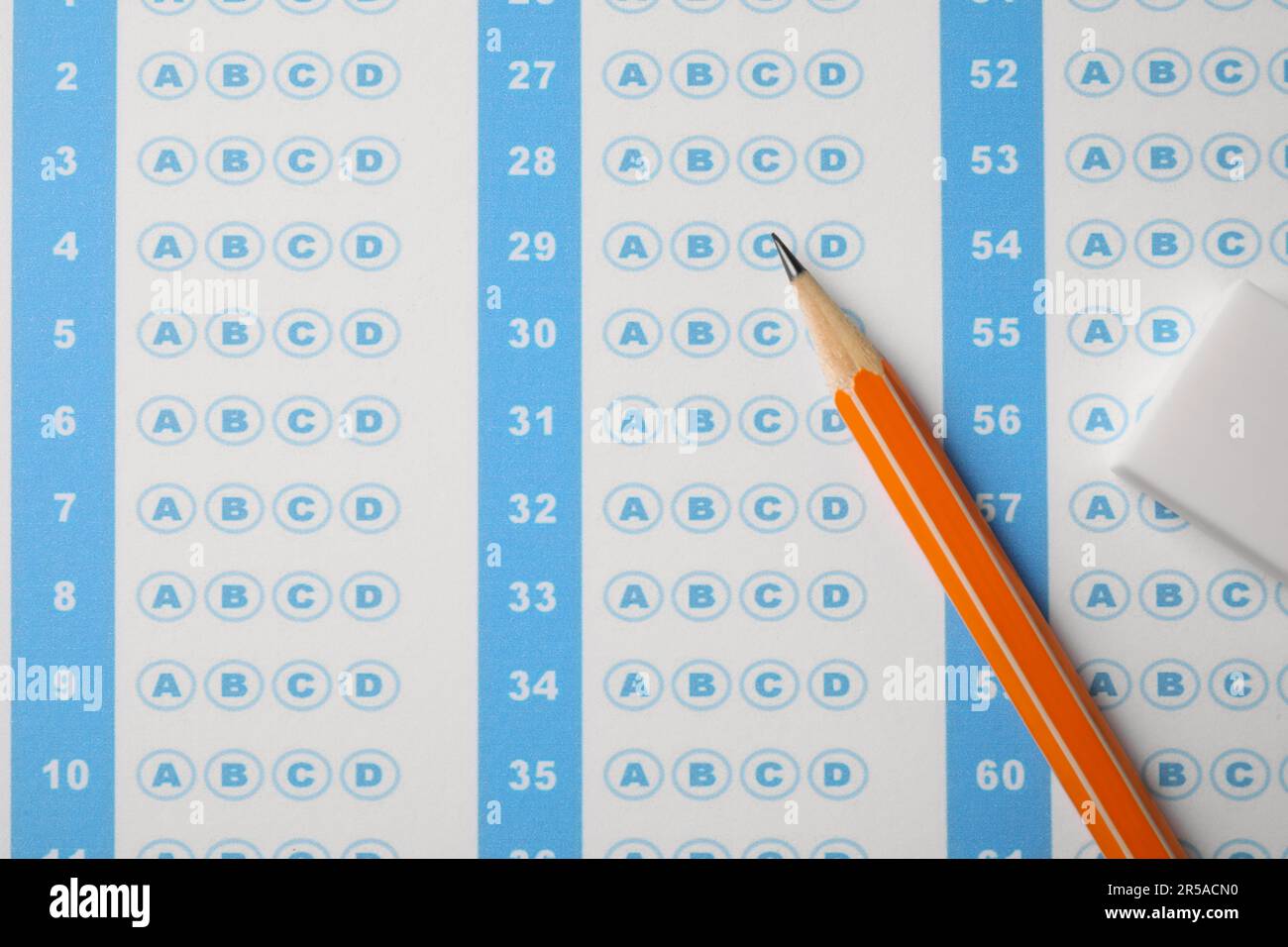 Pencil and eraser on answer sheet, flat lay. Student passing exam Stock ...