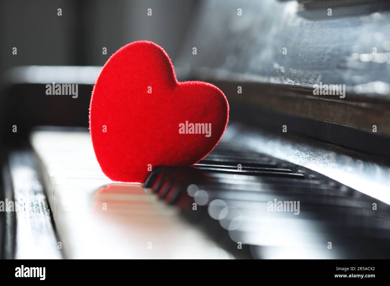Small red decorative heart on piano keys, closeup. Space for text Stock ...