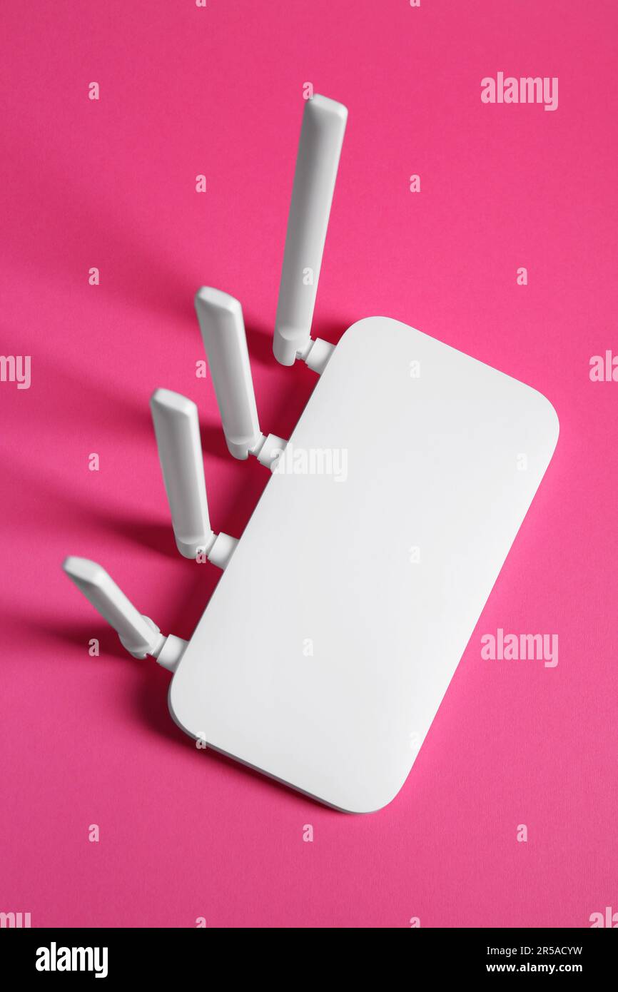 New white Wi-Fi router on pink background, top view Stock Photo - Alamy