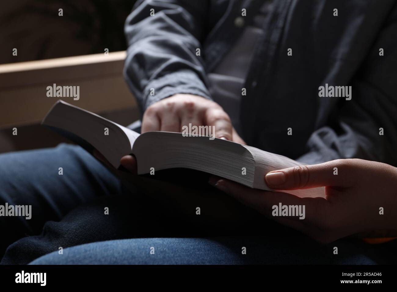 Couple sitting and reading holy Bible indoors, closeup Stock Photo - Alamy